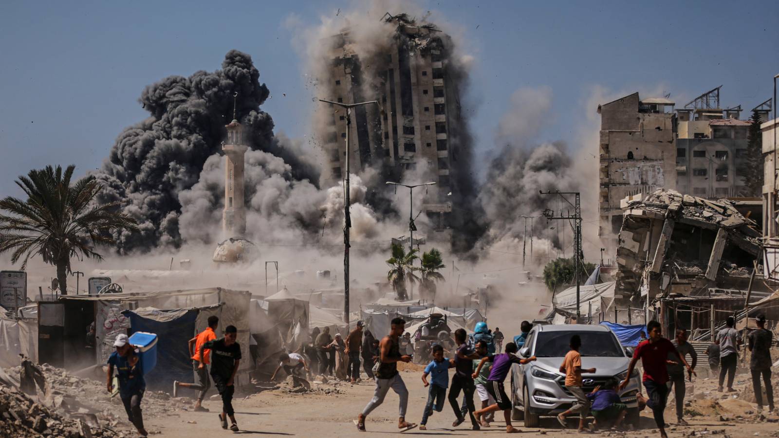 Israel Strikes High-Rise Building and Threatens to Hit More in Gaza ...